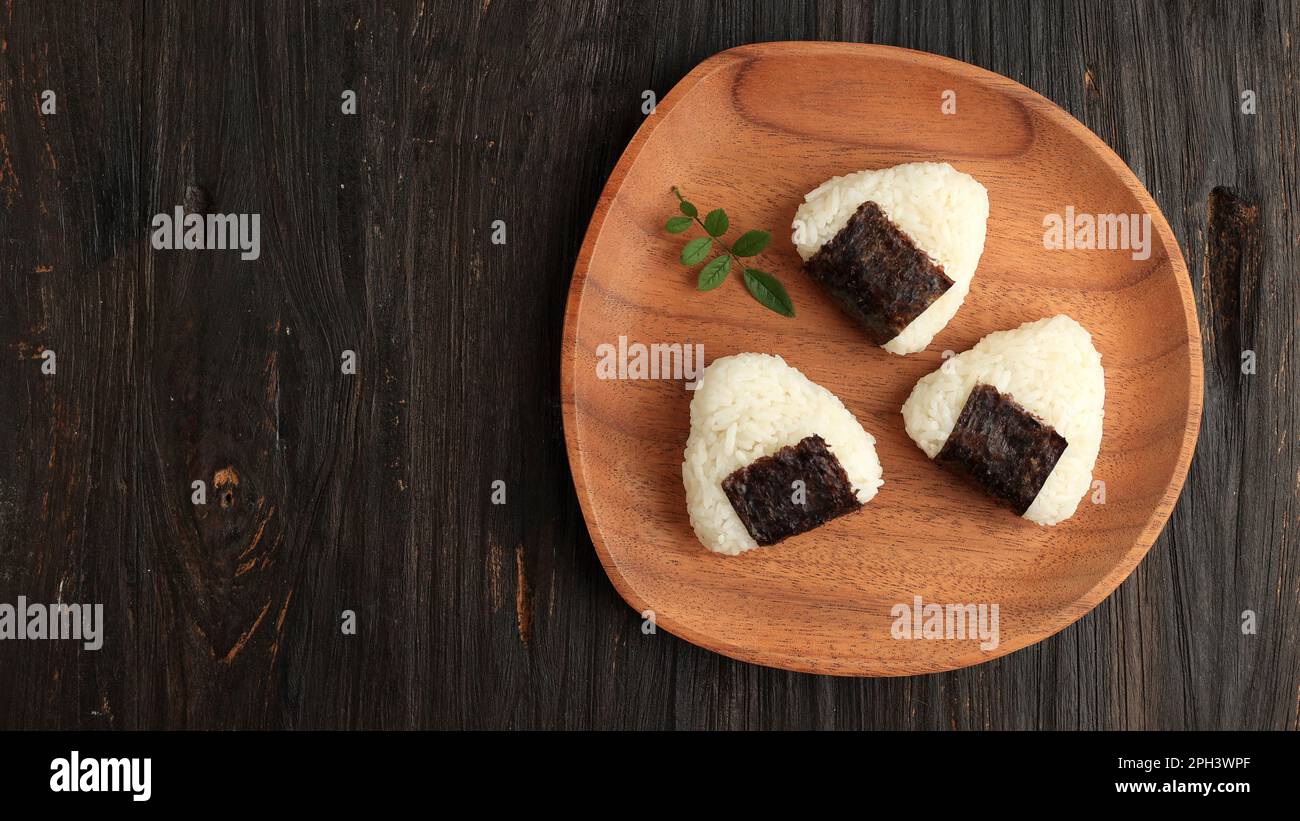 Top View Japanese Triangle Onigiri on Wooden Plate with Copy Space for ...