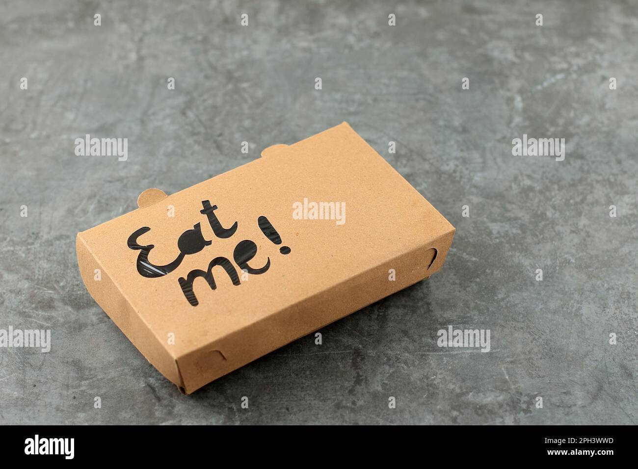 Paper Food Packaging for on the Go Meal with Eat Me Stamp on Top Stock ...