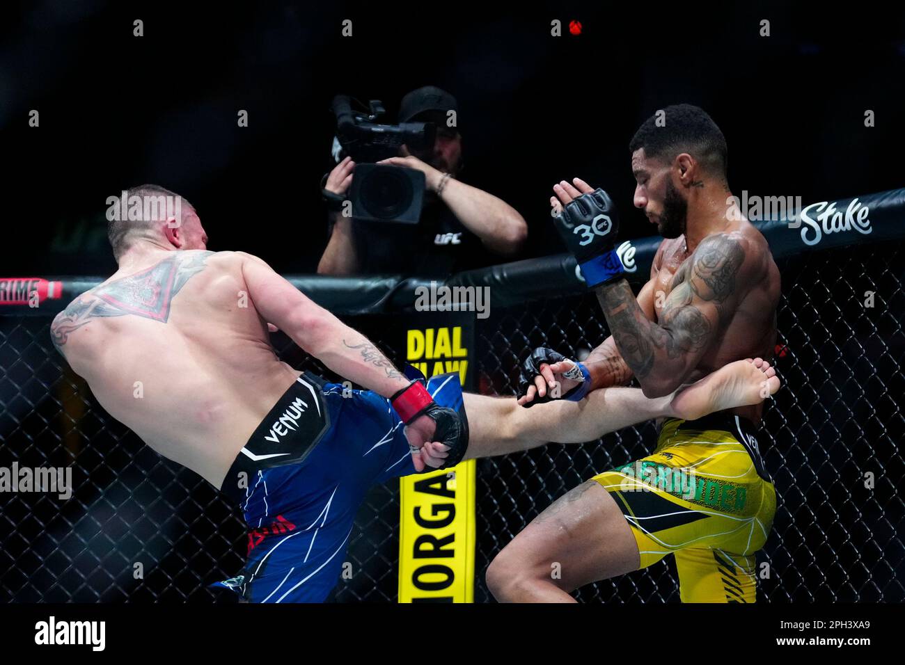 SAN ANTONIO, TEXAS - MARCH 25: (L-R) Steven Peterson kicks Lucas ...