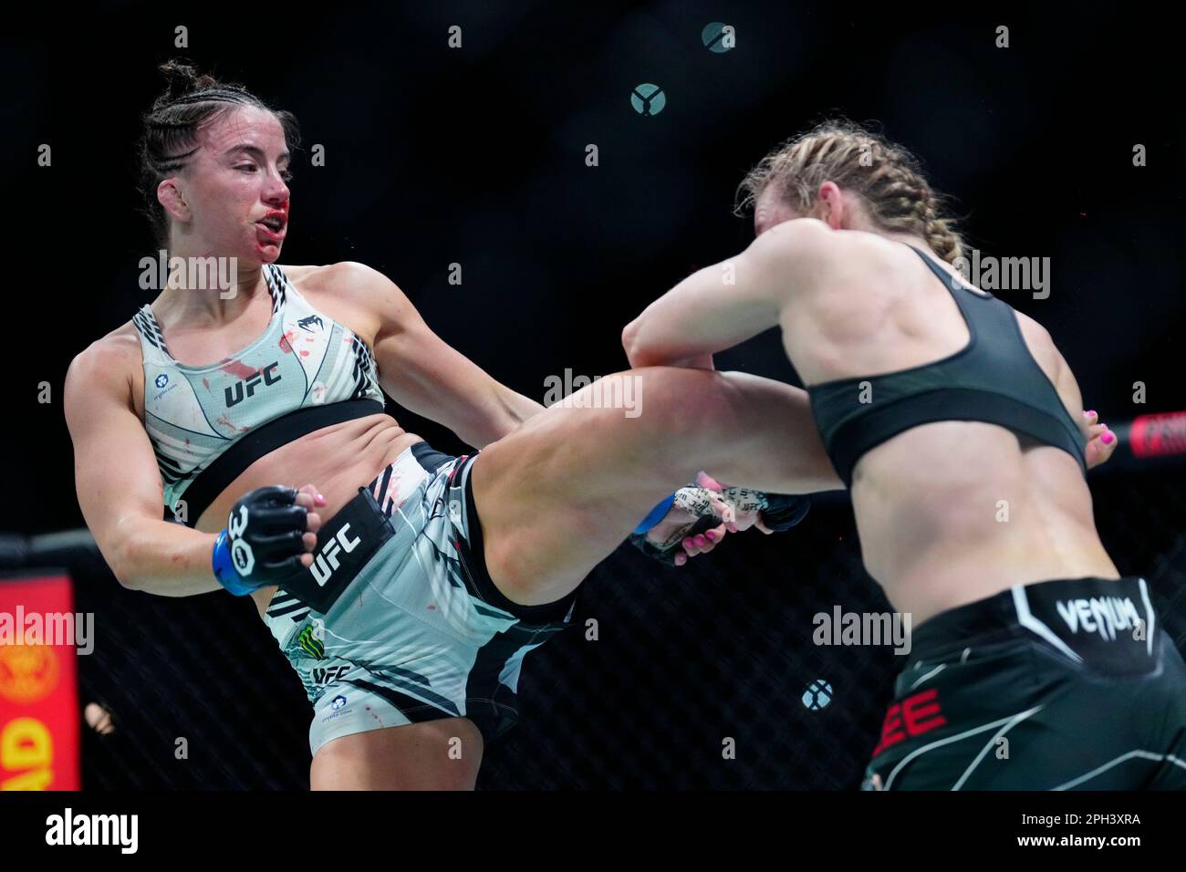 SAN ANTONIO, TEXAS - MARCH 25: (L-R) Maycee Barber kicks Andrea Lee in ...