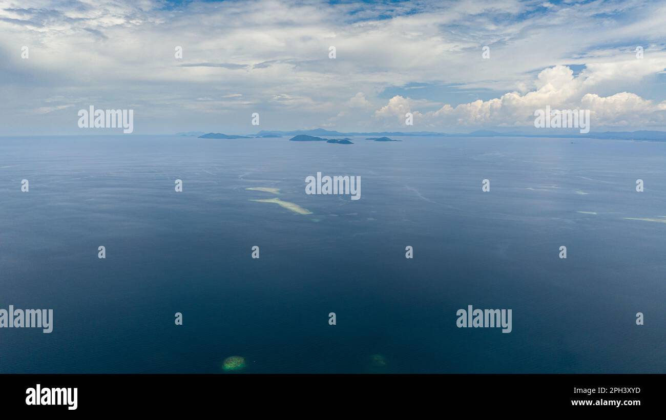 Blue ocean and blue sky with clouds. Seascape in the tropics. Flight ...
