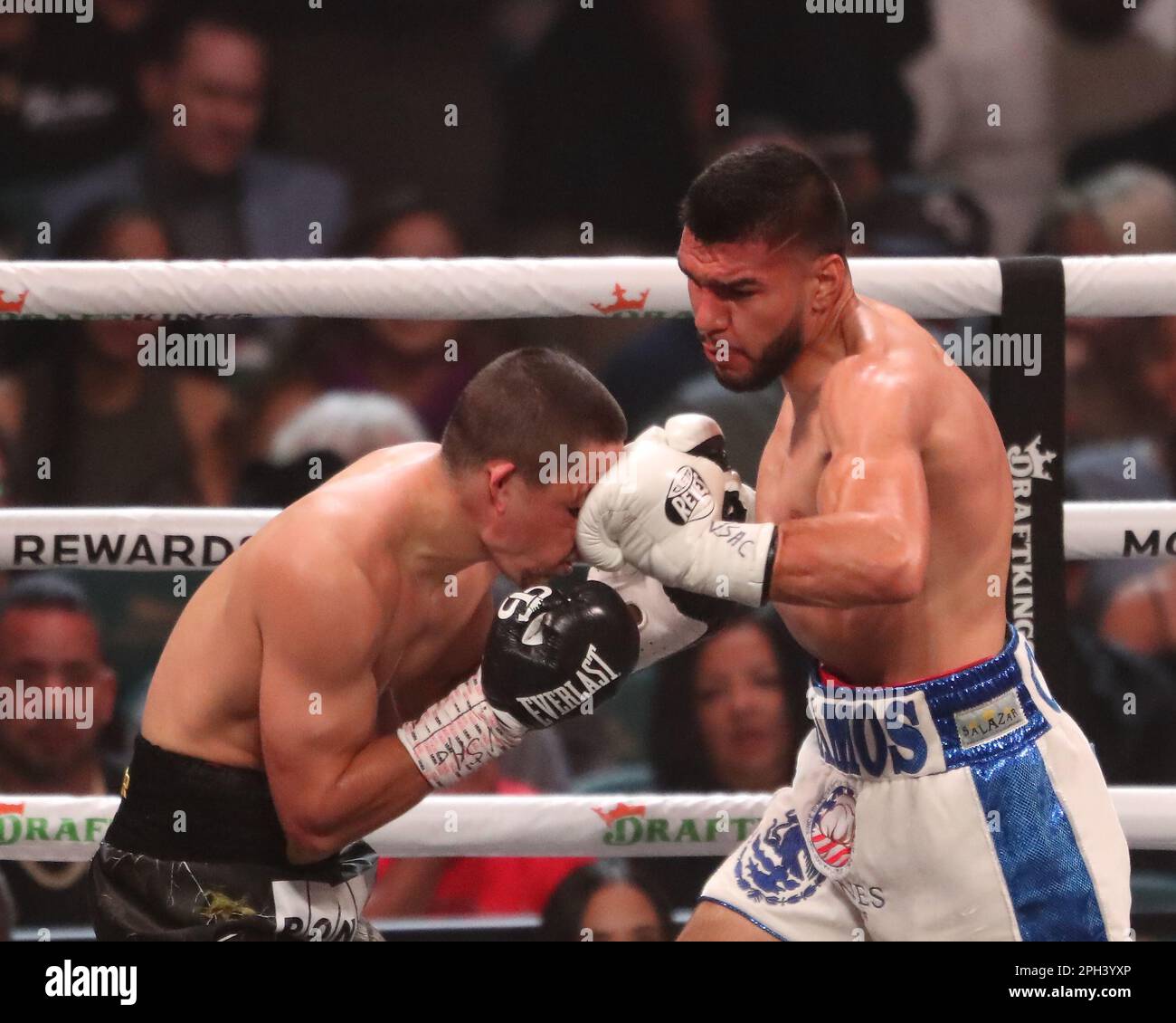 LAS VEGAS, NEVADA - MARCH 25: (R-L) Jesus Ramos punches Joseph Spencer ...