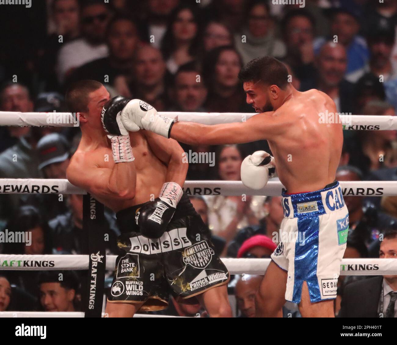 LAS VEGAS, NEVADA - MARCH 25: (R-L) Jesus Ramos punches Joseph Spencer ...