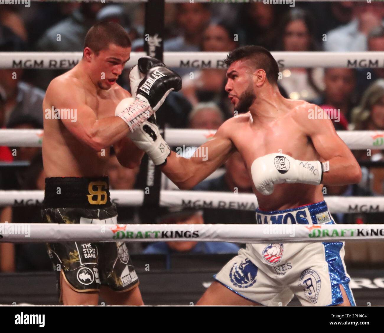 LAS VEGAS, NEVADA - MARCH 25: (R-L) Jesus Ramos punches Joseph Spencer ...