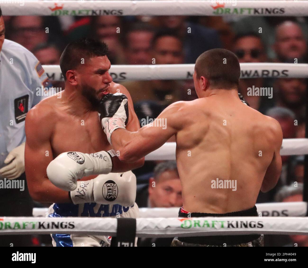 LAS VEGAS, NEVADA - MARCH 25: (R-L) Joseph Spencer punches Jesus Ramos ...