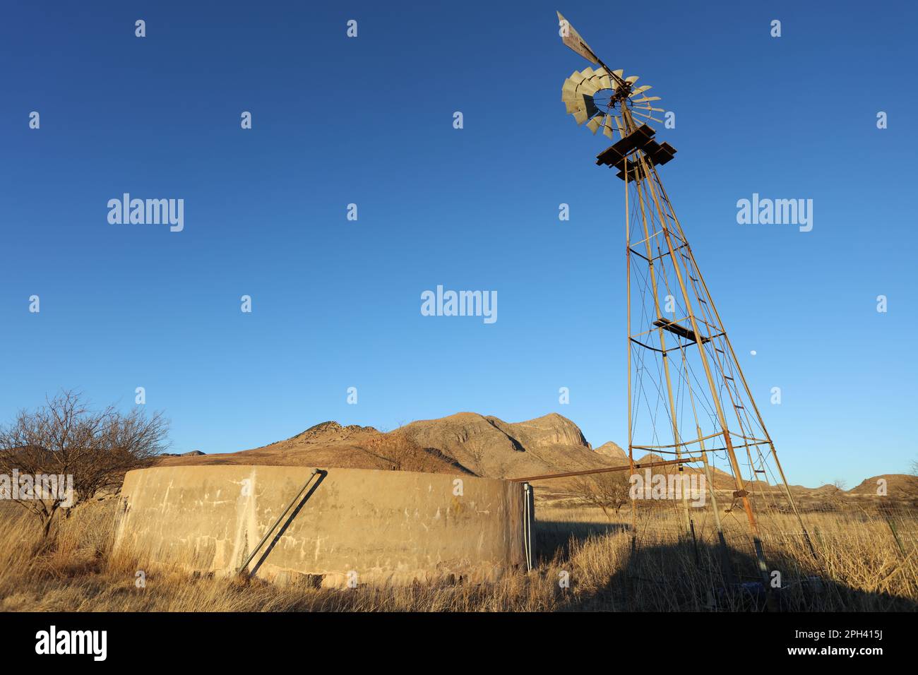 Mustang Mountain Windmill and Water Tank Stock Photo - Alamy