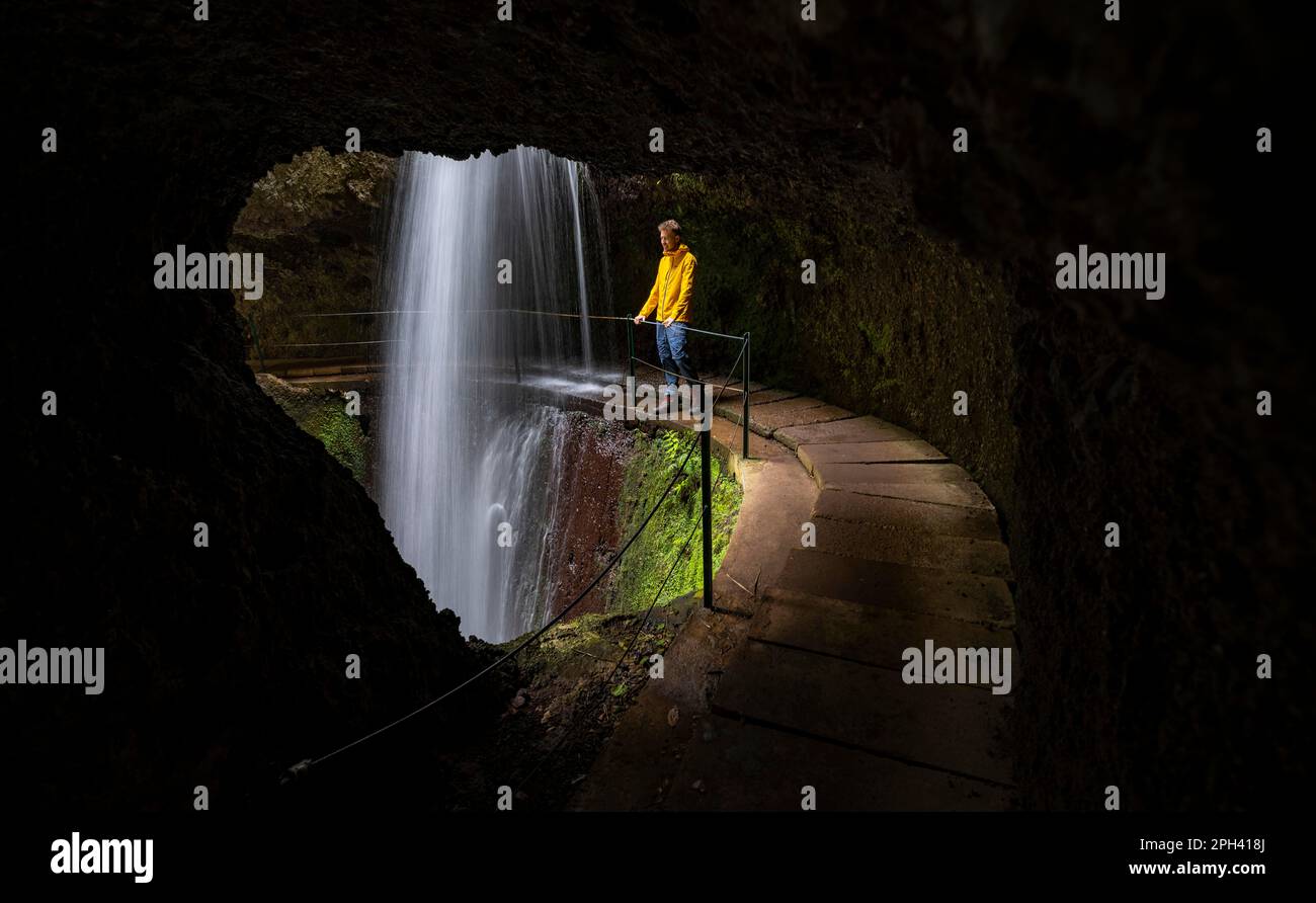 Hikers at Levada Nova, Nova waterfall and Moinho in a gorge, long ...