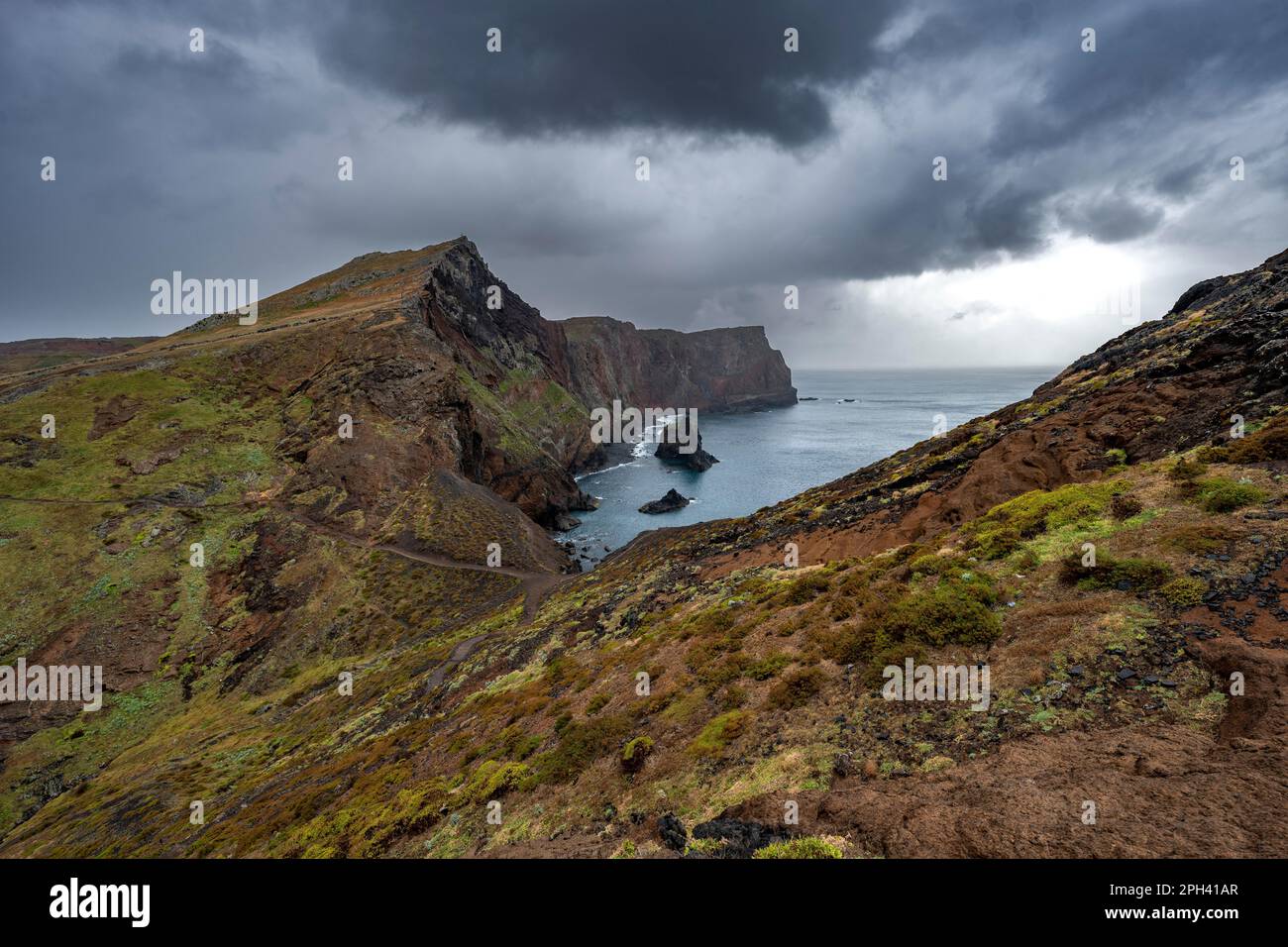 Coastal landscape with red cliffs and sea, rugged coast with rock ...