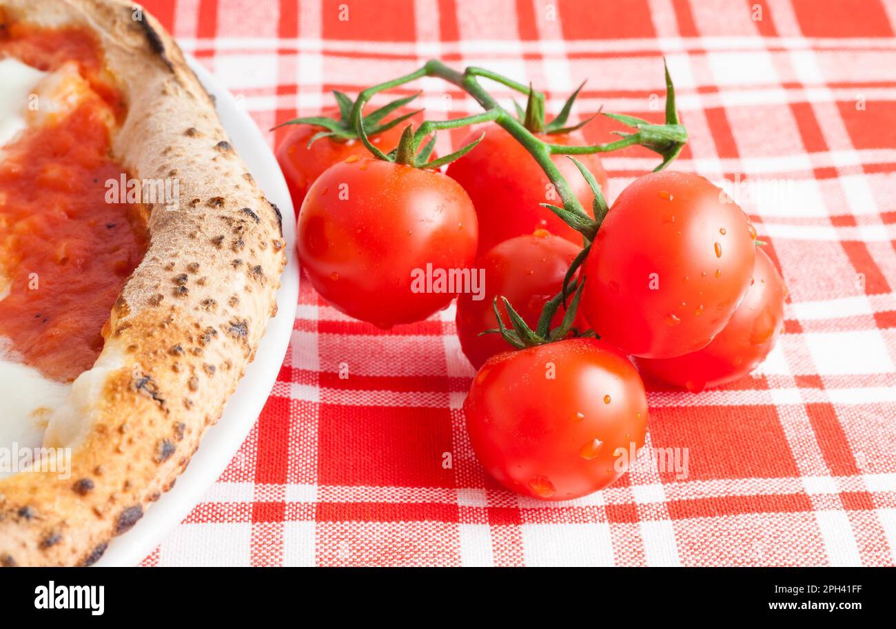 Detail of a Real Italian Pizza in Naples with Ciliegino tomatos Stock ...