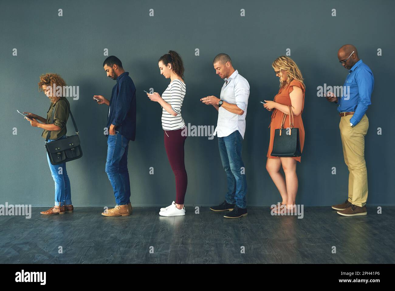 Were would we be if we didnt have phones. a group of people standing in ...