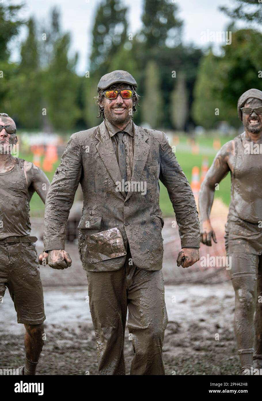 Christchurch, New Zealand. 26th Mar, 2023. A man covered in mud wears a ...