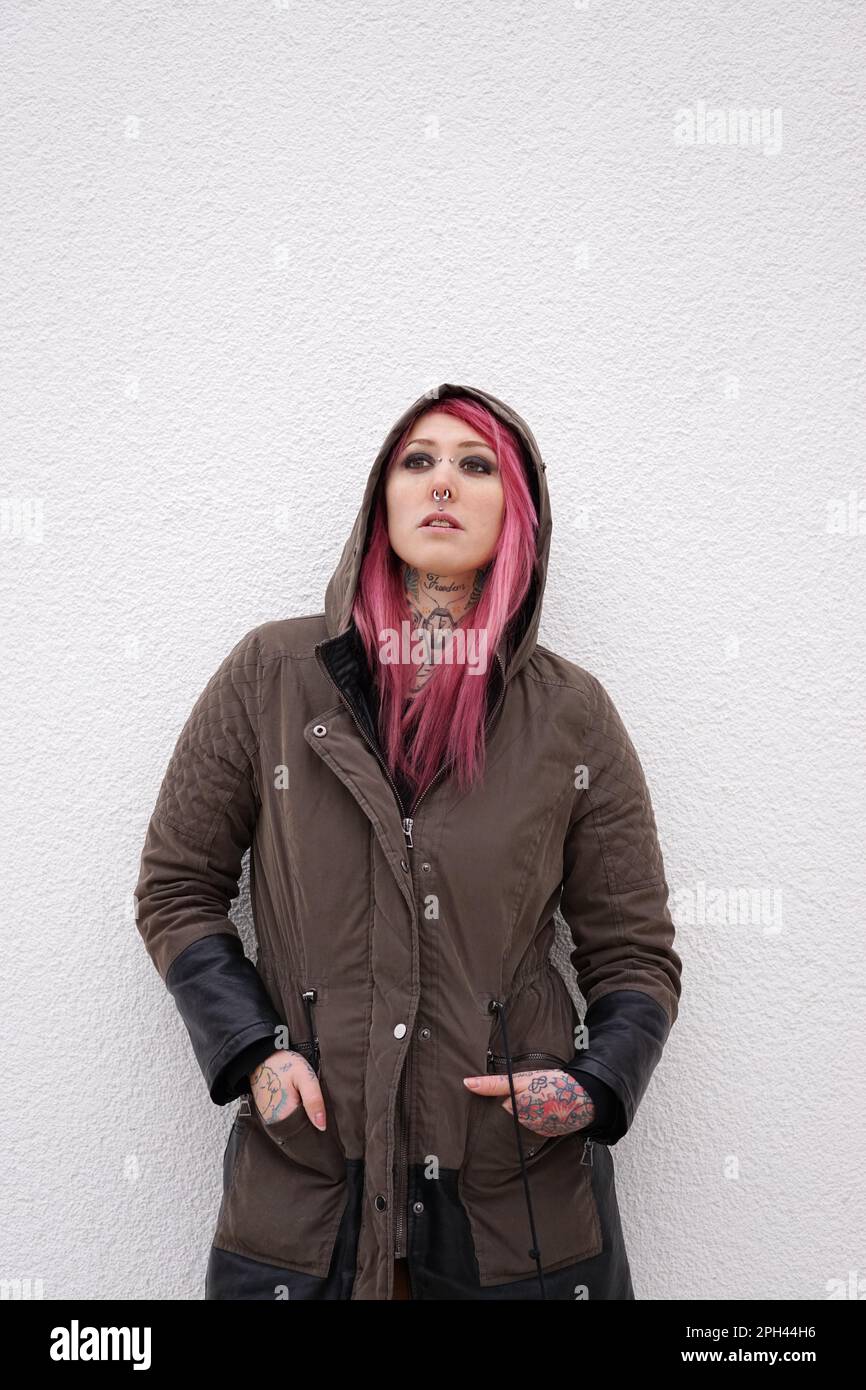 young alternative woman with pink hair piercings and tattoos Stock ...