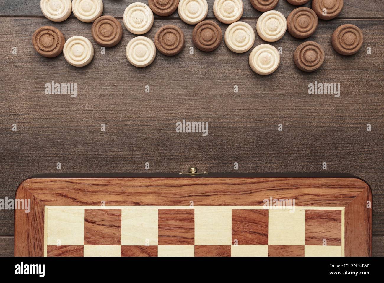 wooden draughts game on brown table background Stock Photo - Alamy
