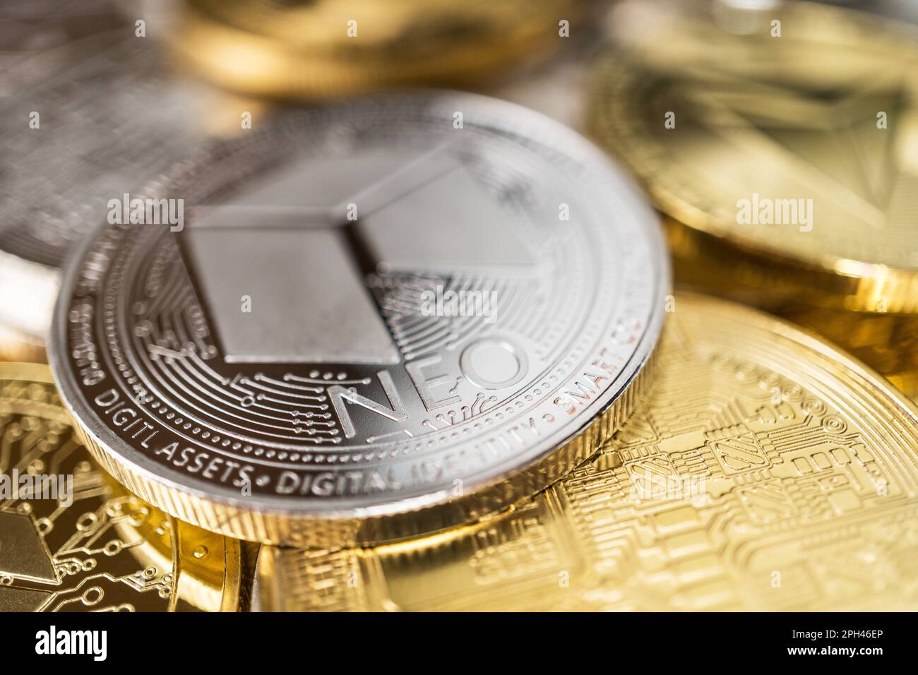 Neo physical coin on the stack of other different cryptocurrencies ...