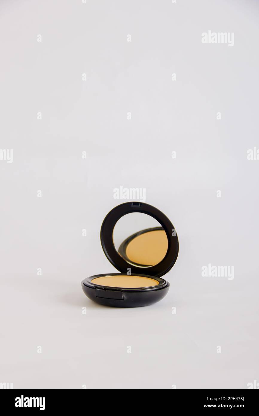 powder with black container plus glass in one makeup package. with ...