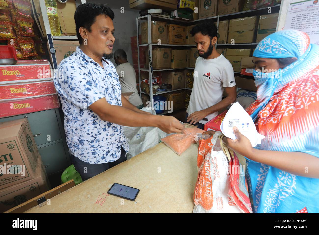 Bangladesh Trading Corporation sells necessary food products at subsidised prices. People crowd ...