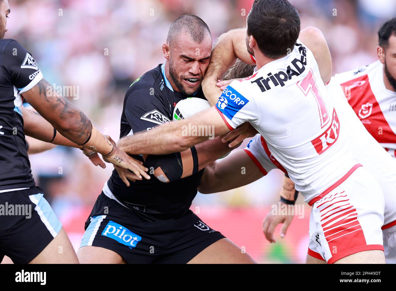 Toby Rudolf of the Sharks is tackled by Bent Hunt of the Dragons during ...