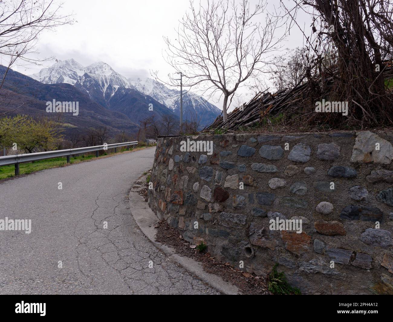 Elevated road in Nus in the Aosta Vallet Italy with stone wall on the ...