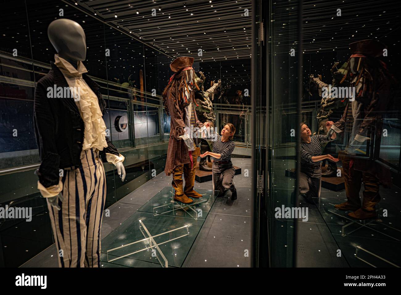 Costumes and pirate inspired designer fashion outfits are positioned ...