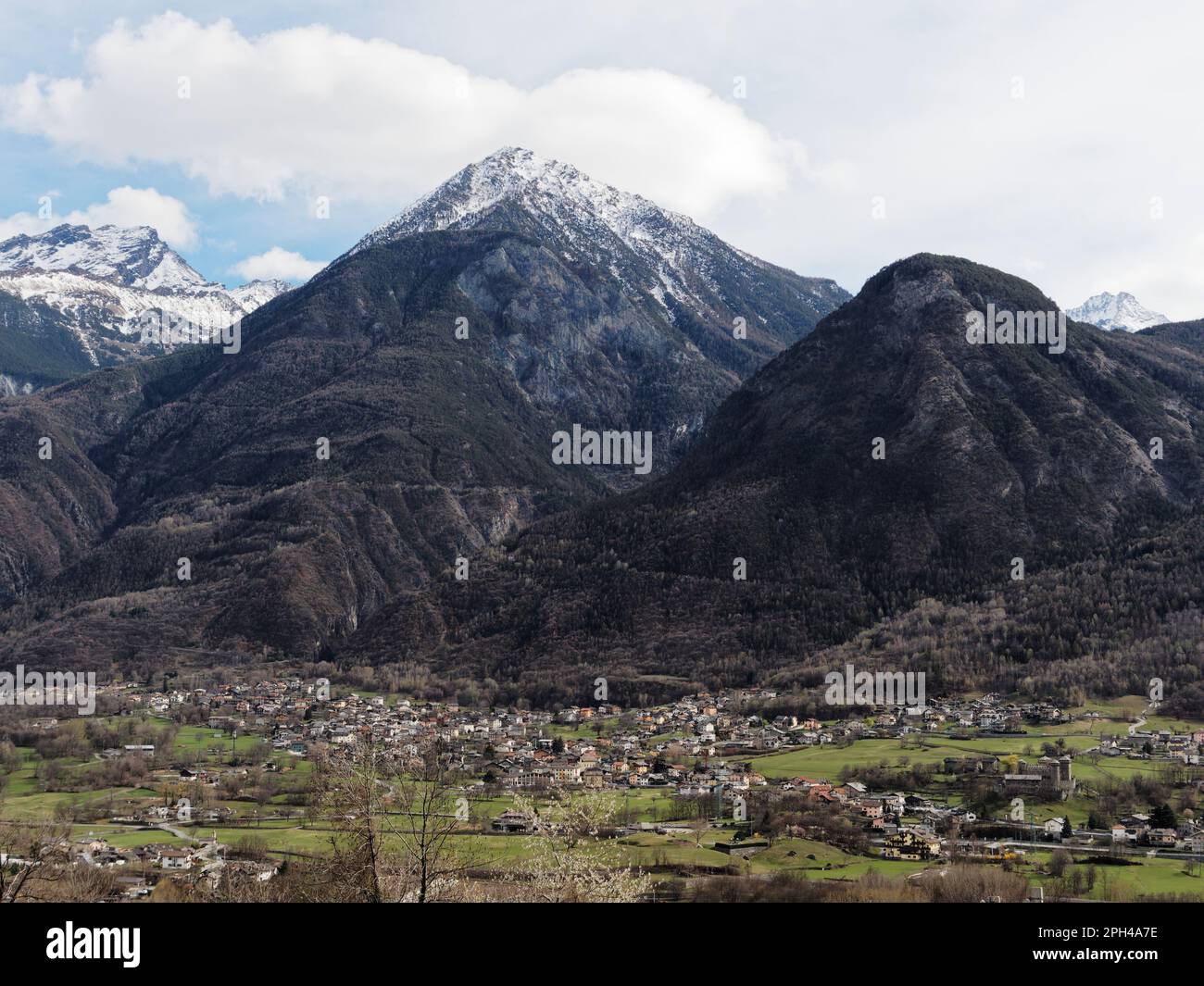 The town of Fenis and its Castle beneath snow-capped mountains in the ...