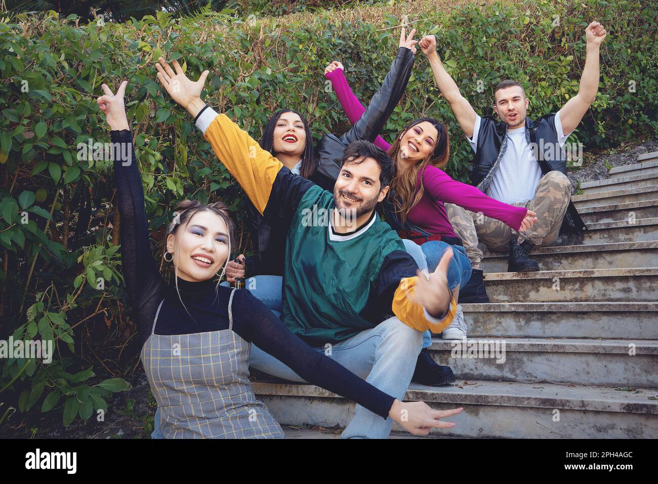 Five young people, one of Asian ethnicity and the rest Caucasian ...