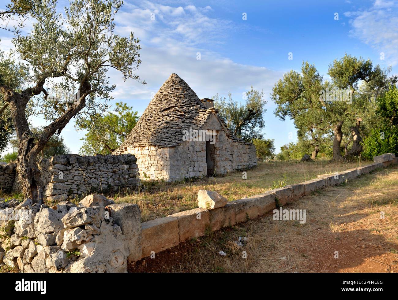 traditional house the trulli in stone and with a conical roof in ...
