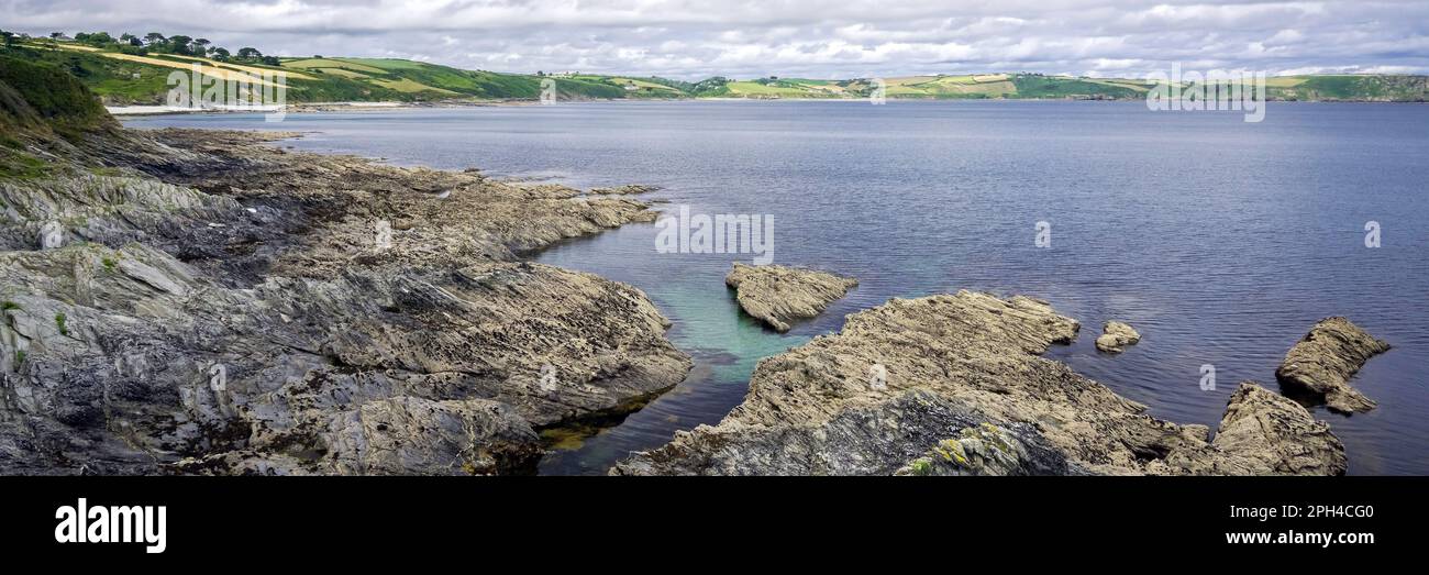 View the sea and rock at Porthbean beach, Cornwall, UK Stock Photo - Alamy