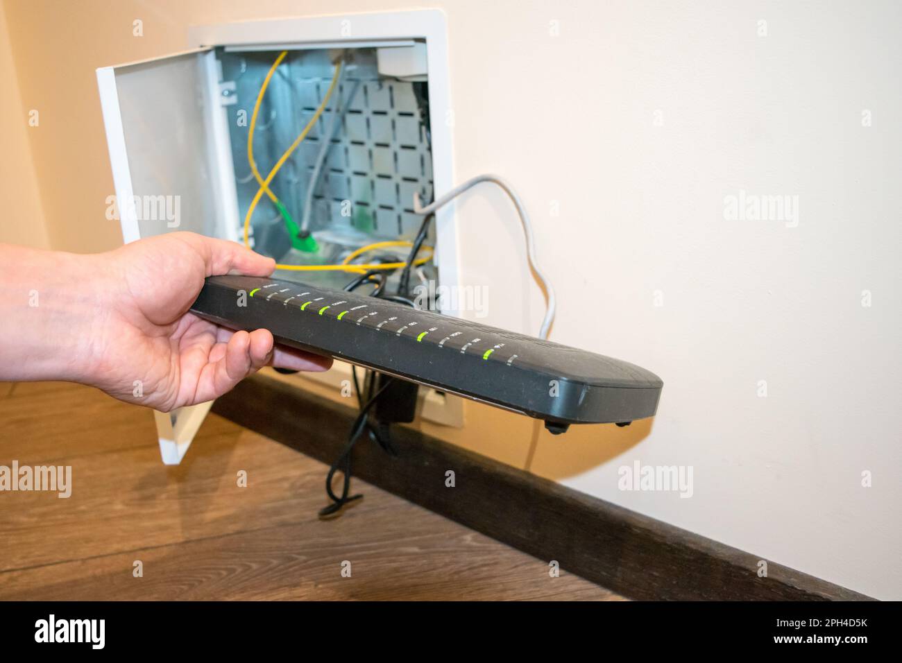 Open box to router, human hand human hand is holding black router Stock ...