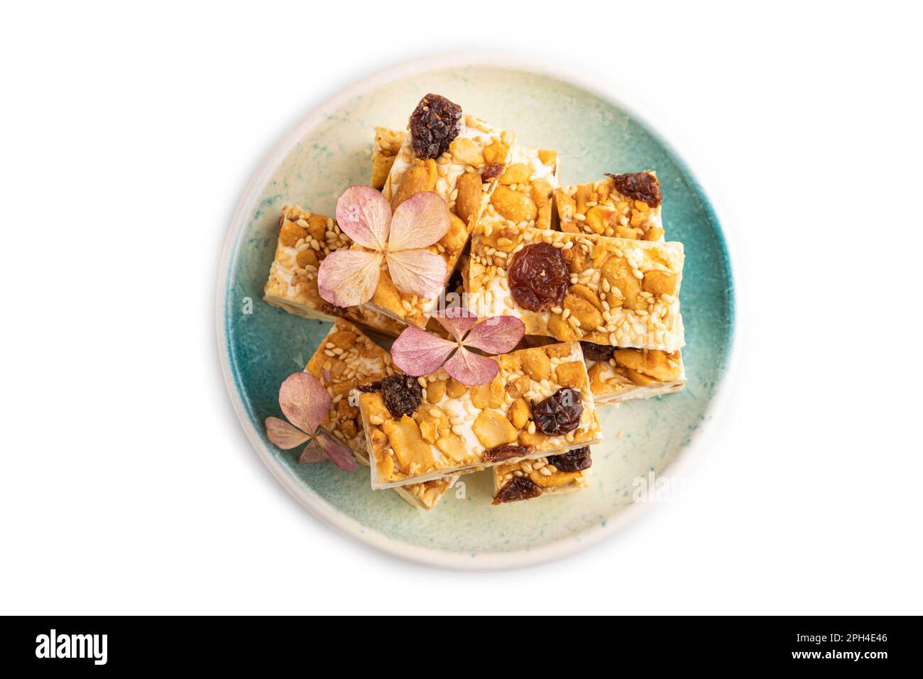 Traditional candy nougat with nuts and sesame isolated on white ...