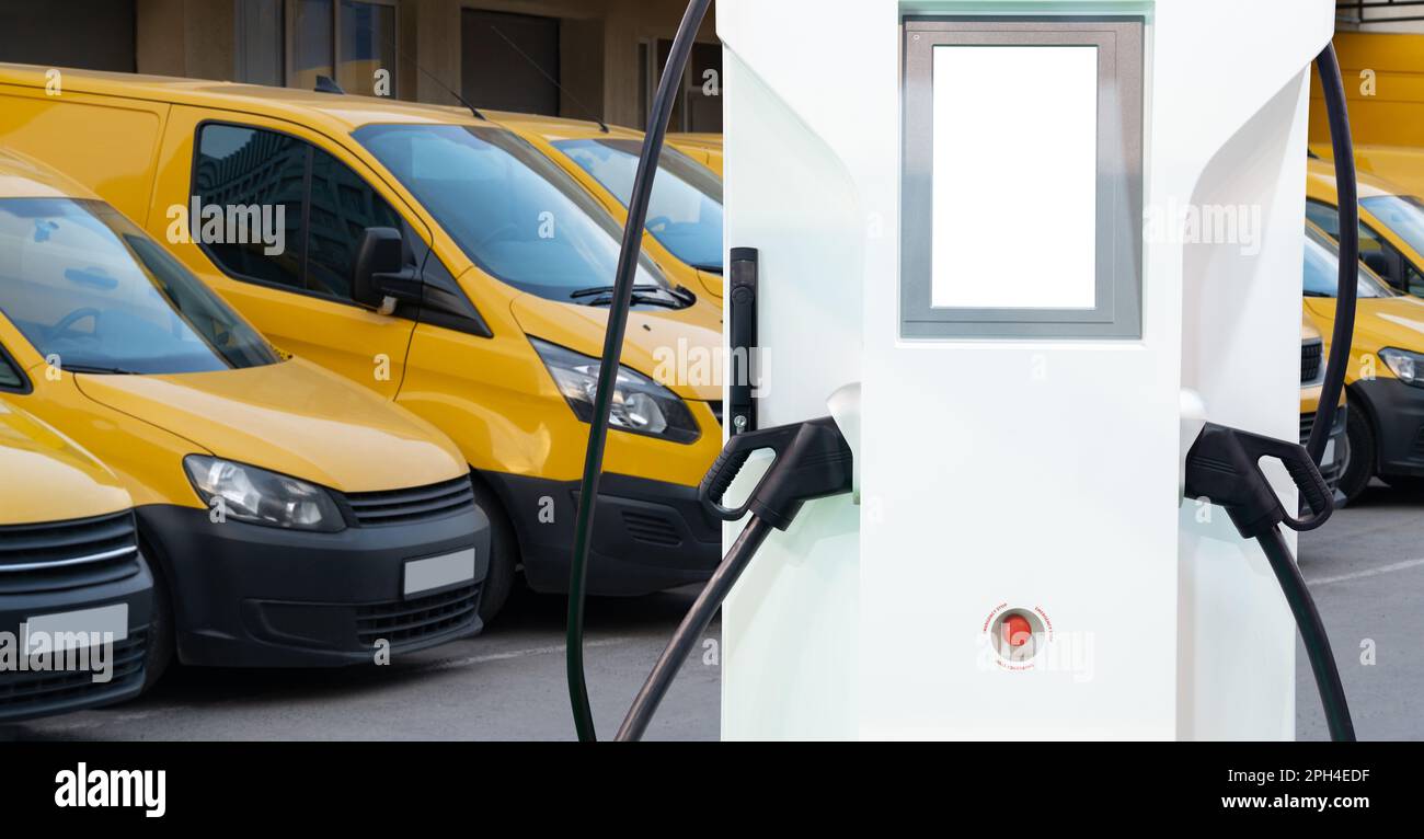 Electric delivery vans with electric vehicles charging station. High ...