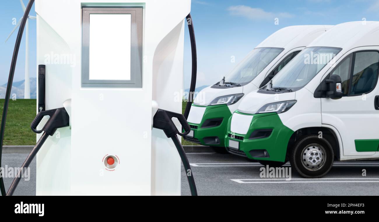 Electric delivery vans with electric vehicles charging station. High ...