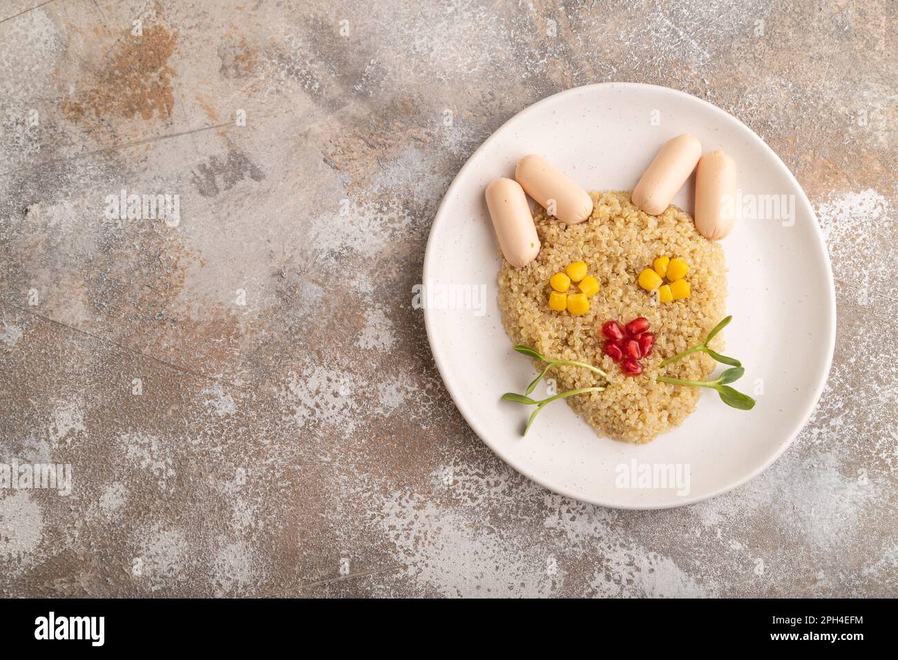 Funny mixed quinoa porridge, sweet corn, pomegranate seeds and small ...