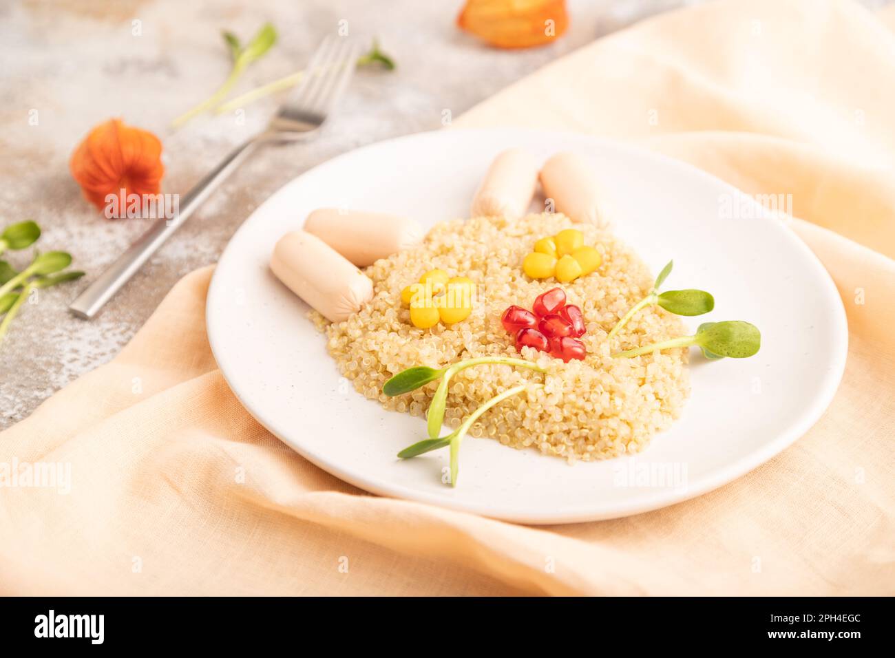Funny mixed quinoa porridge, sweet corn, pomegranate seeds and small ...