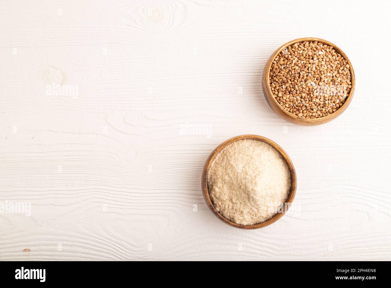 Powdered milk and buckwheat baby food mix, infant formula on white ...
