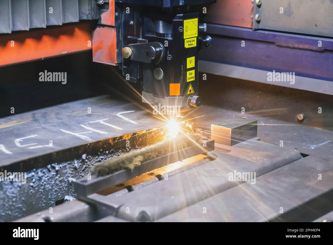 Numerical control machine cuts metal sheet with laser Stock Photo - Alamy