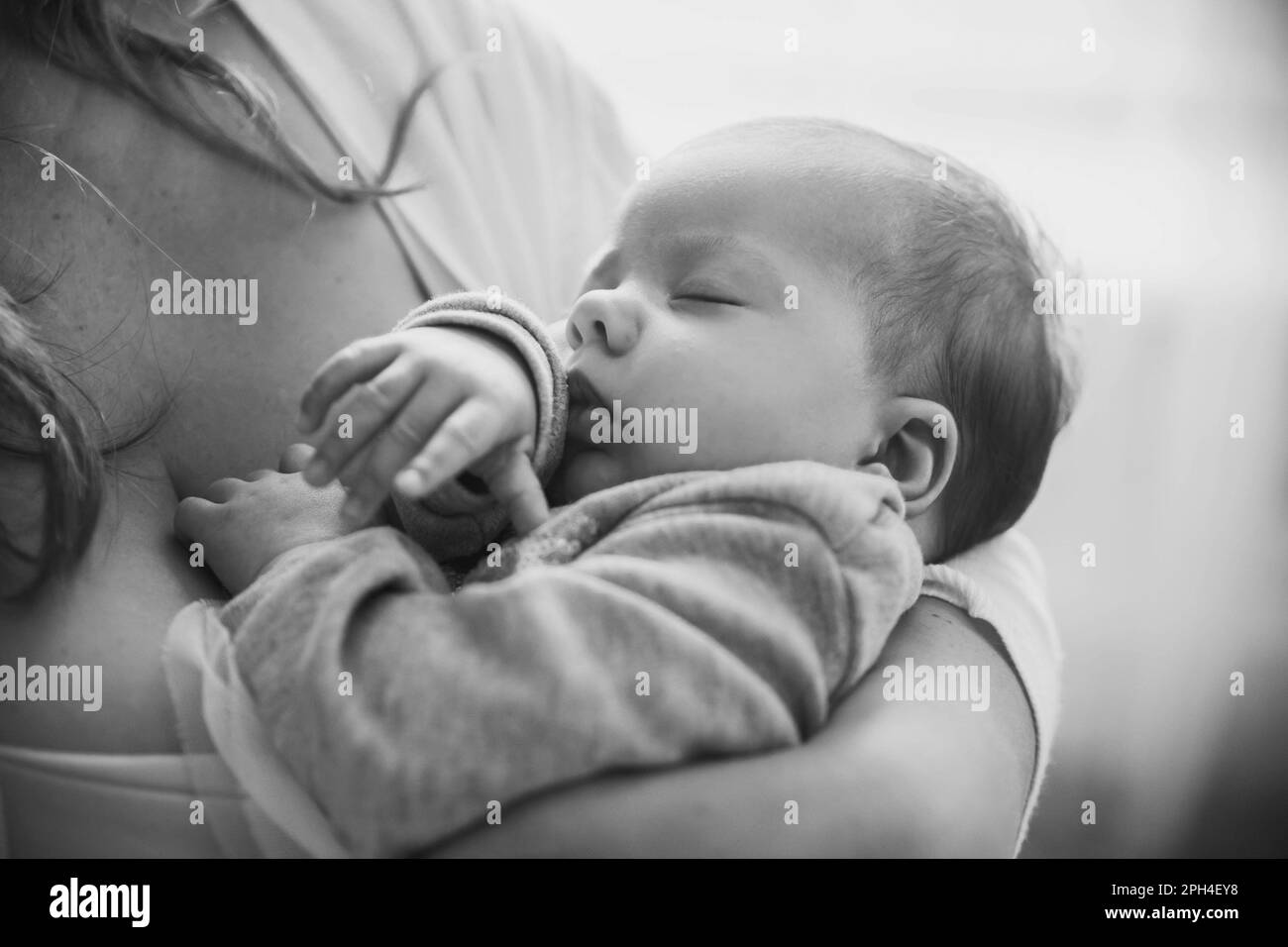 Mother holds baby Black and White Stock Photos & Images - Alamy