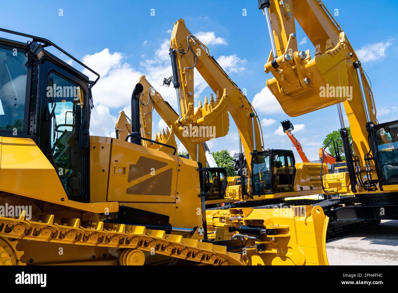 Fleet of yellow construction machines. High quality photo Stock Photo ...