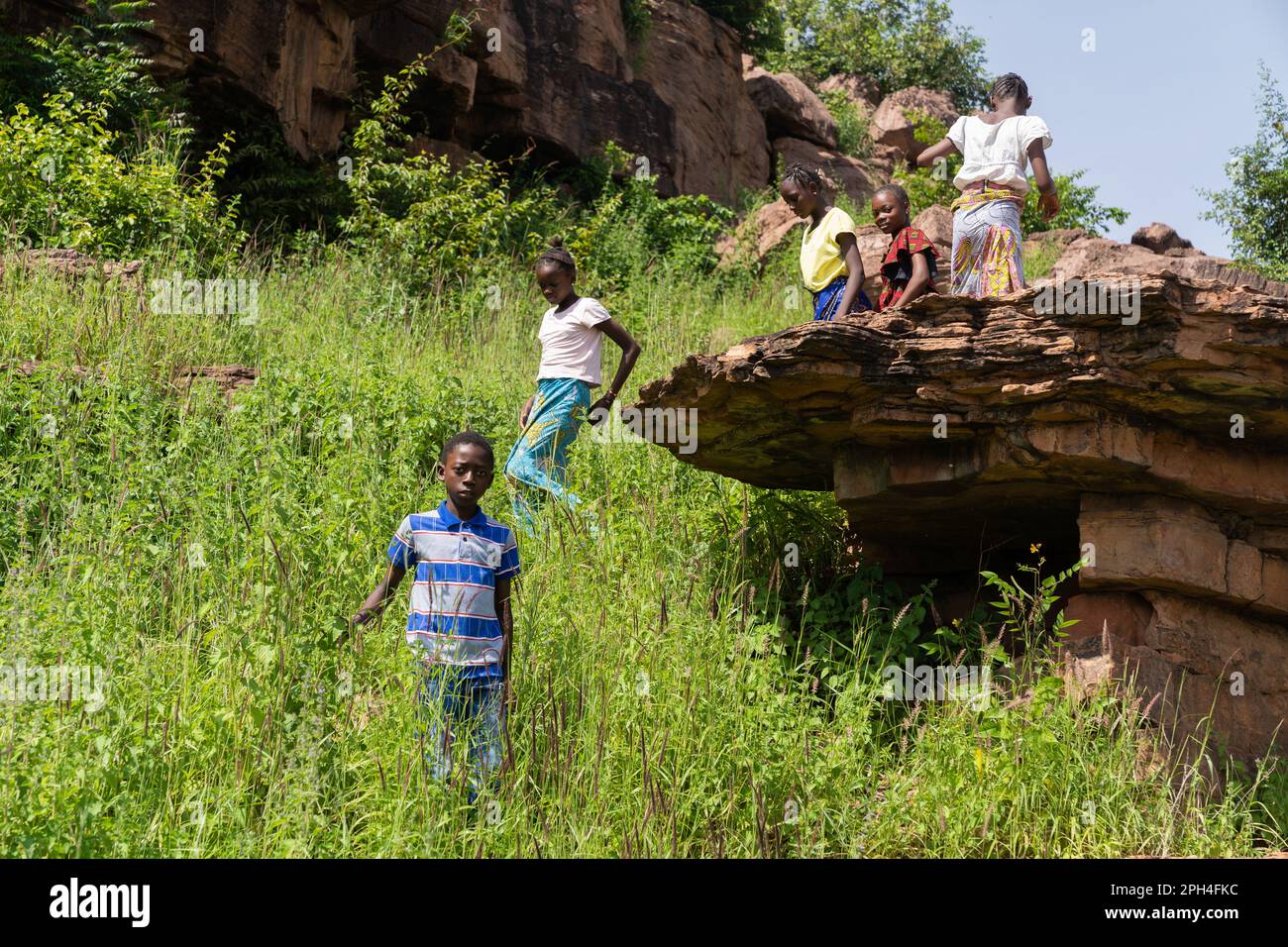 Group of West African children strolling through the bush Stock Photo ...