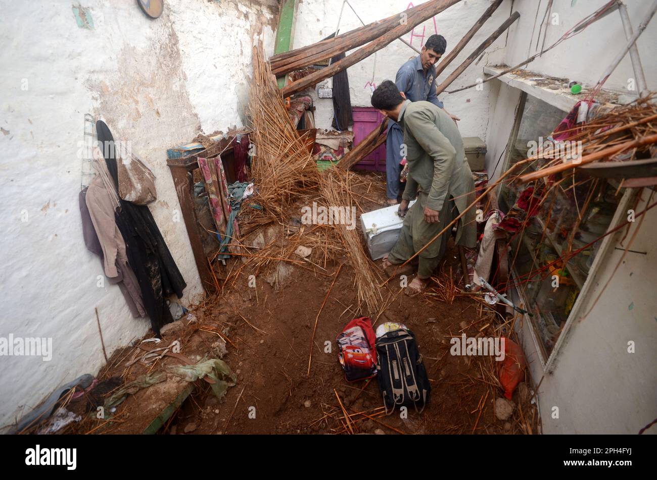 Peshawar, Pakistan. 25th Mar, 2023. People inspect the damaged room ...