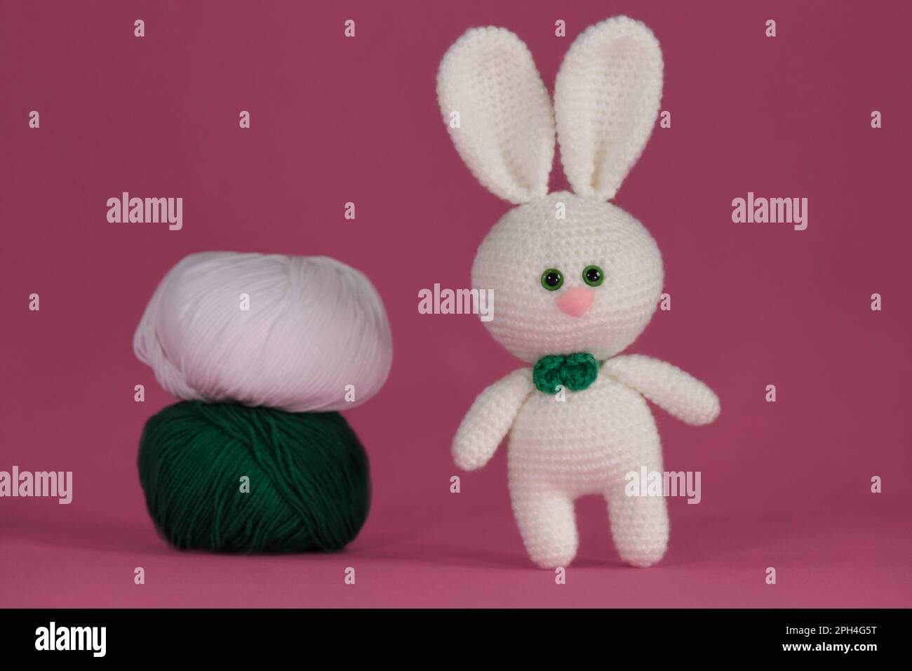 Concept symbol of Catholic Easter. White Easter bunny crocheted ...