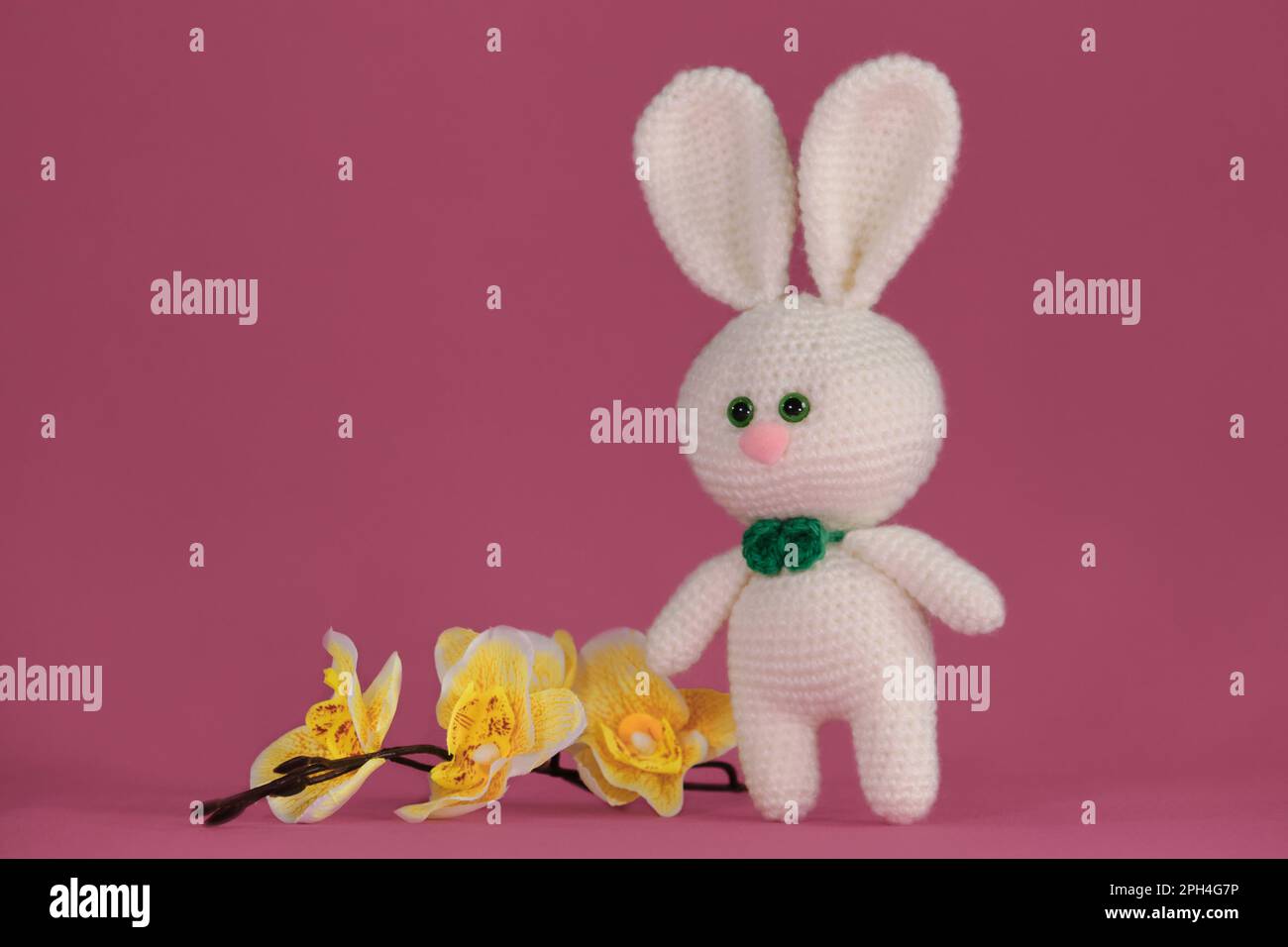 Concept symbol of Catholic Easter. White Easter bunny crocheted ...
