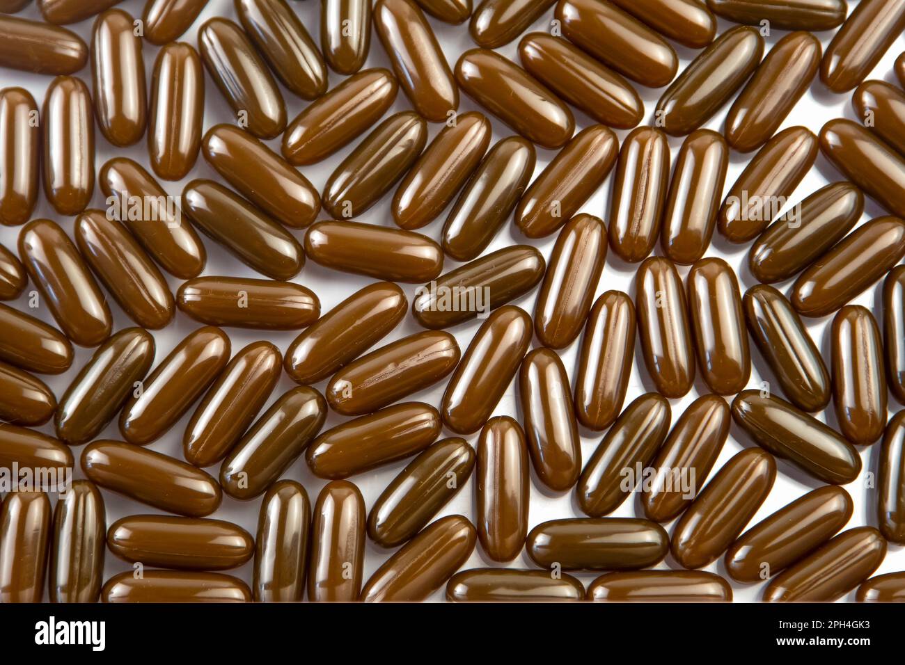 A lot of brown pills top view. Vitamins tablet background. Treatment, medicine, pharmacy ...