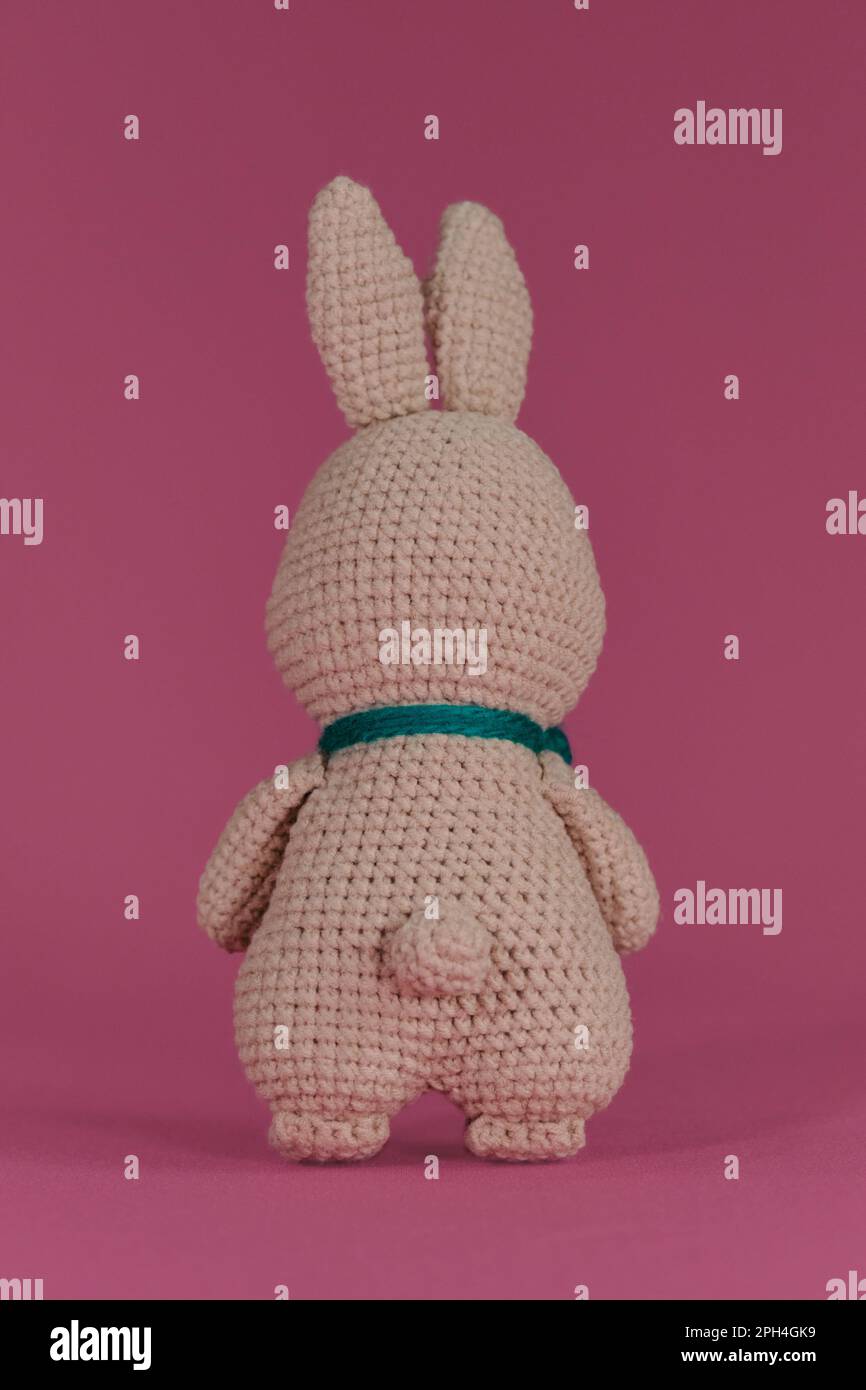 Symbol of Catholic Easter. Grey cute Easter bunny with green bow tie ...