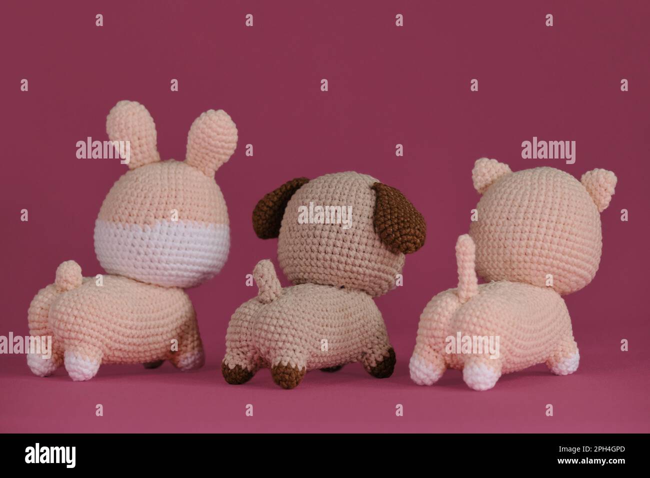 Cute little kitten, puppy and rabbit crocheted, handmade art. Rear view ...