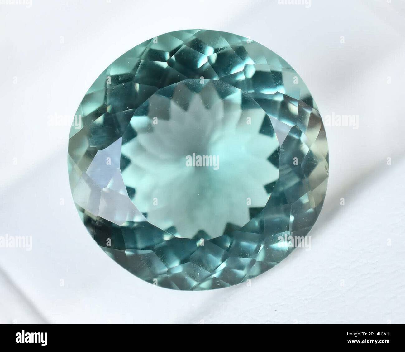 Natural gemstone green blue amblygonite isolated on white background ...