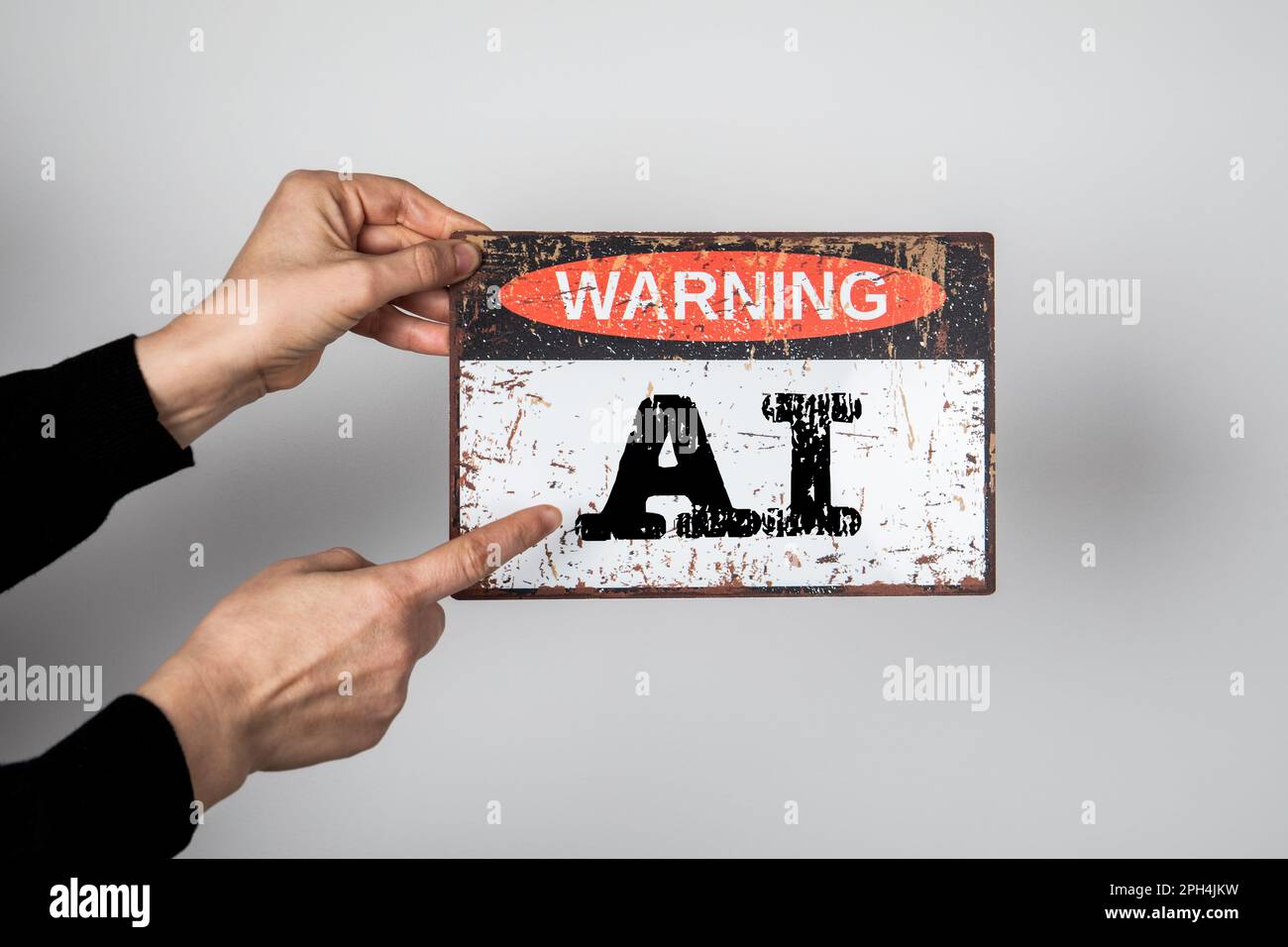 AI. Artificial Intelligence. Warning sign with text in the hands of a ...