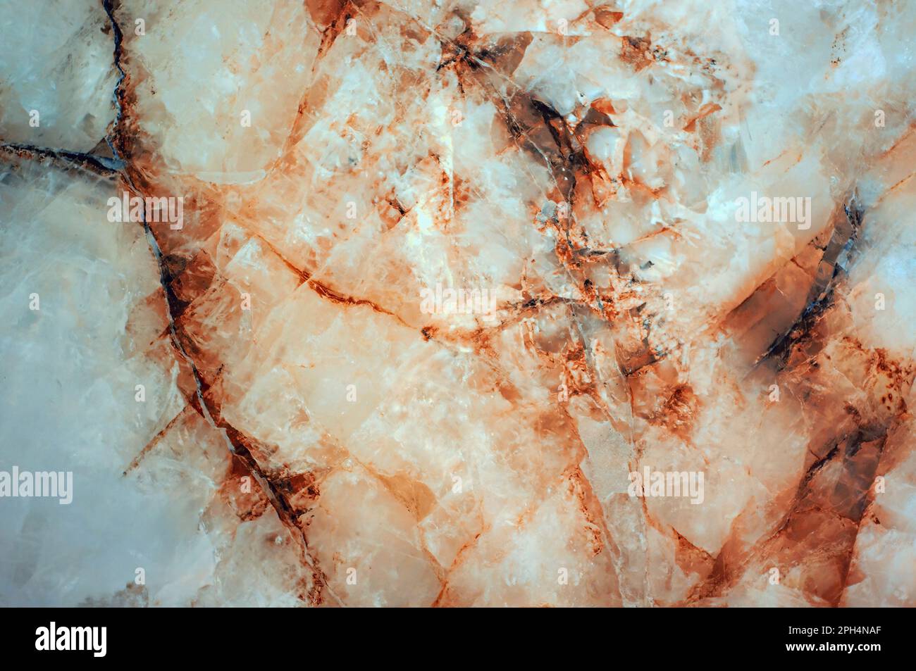The background of a cream-colored marble slab with rusty brown streaks ...