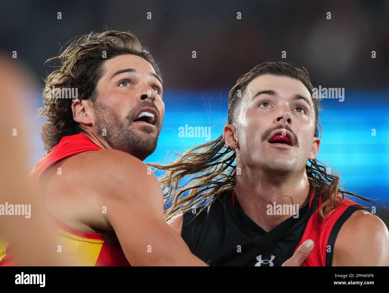 Levi Casboult of the Suns and Sam Draper of the Bombers compete for the ...