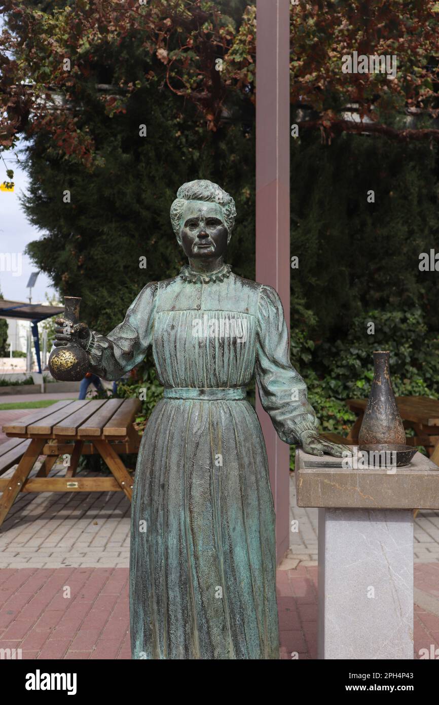 The Statue of Marie Curie Holding Her Science Experiment Equipment ...