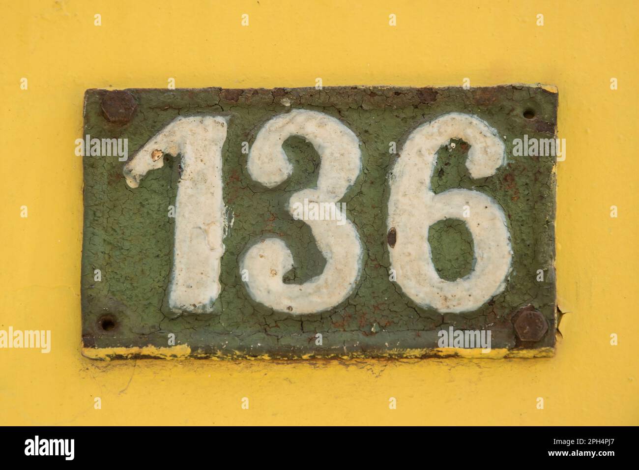 Old retro weathered cast iron plate with number 136 Stock Photo - Alamy